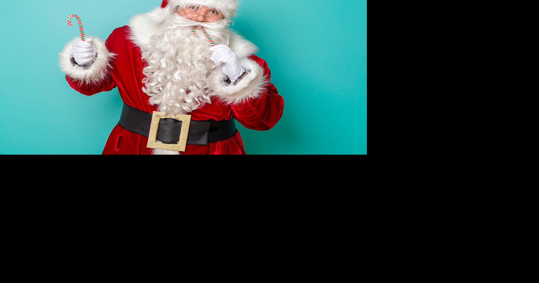 Santa handing out candy canes on Woodstock Drive
