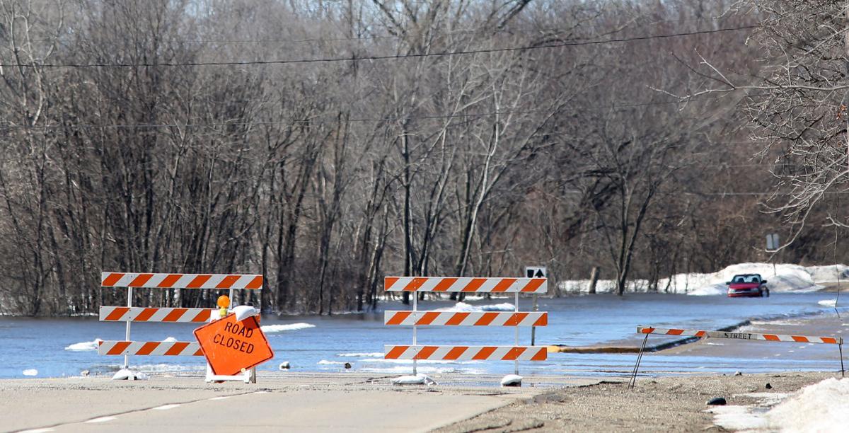 Waterloo firefighters rescue driver from flooded road