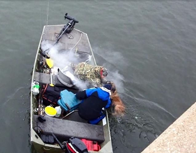 VIDEO: Fishermen rescue dog from frigid river