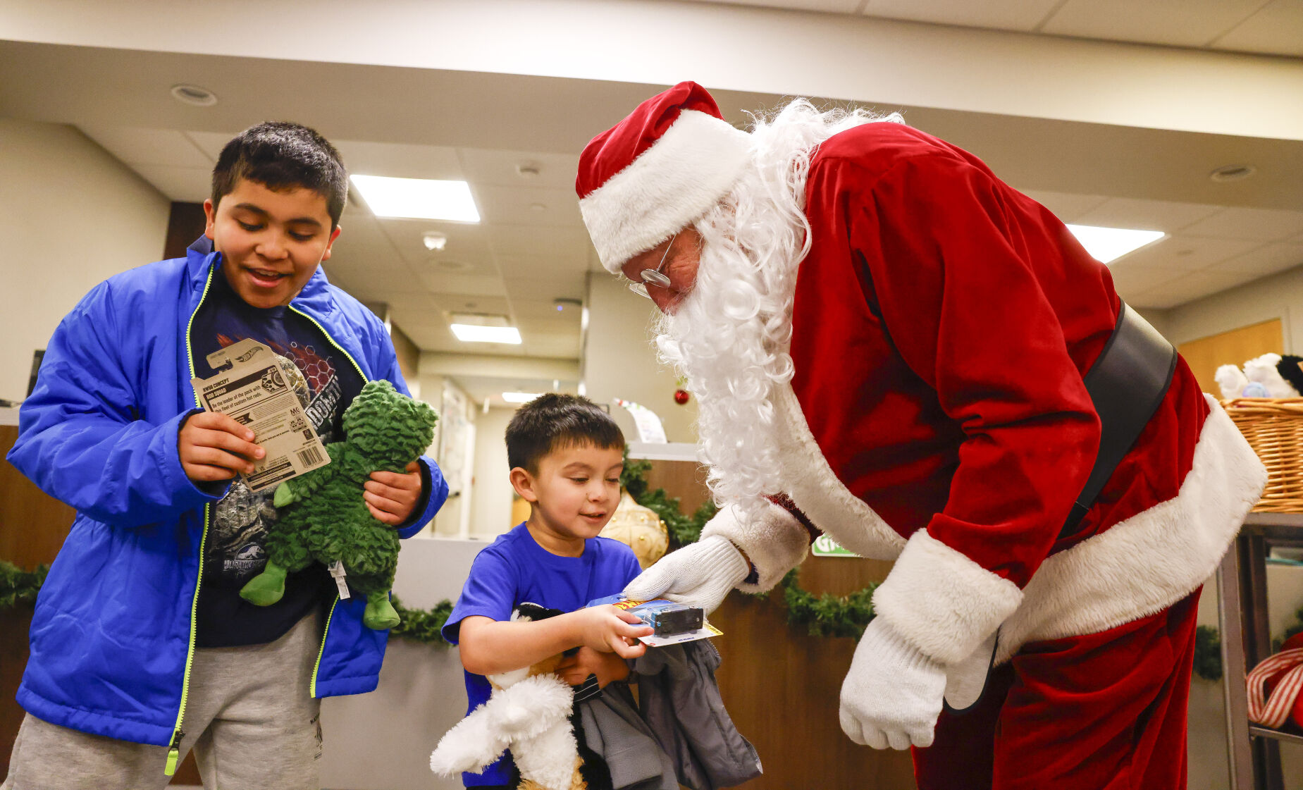 Santa makes the rounds to Allen Hospital patients on Monday
