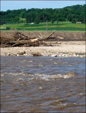 Farmers work to reclaim flood-damaged farm fields
