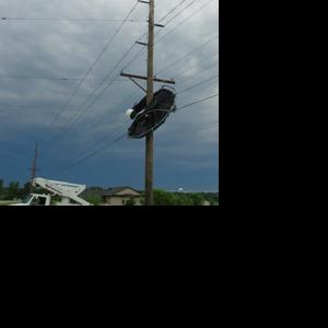 PHOTOS: Trampoline gets lodged in Waverly power lines
