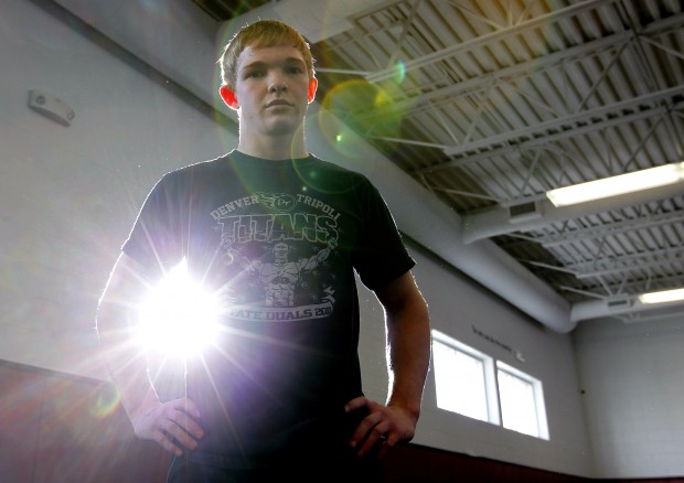 Prep wrestling: Titans win 2A sectional as nine move on