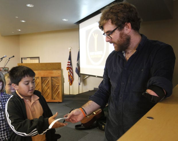 One-handed guitarist uses music to inspire