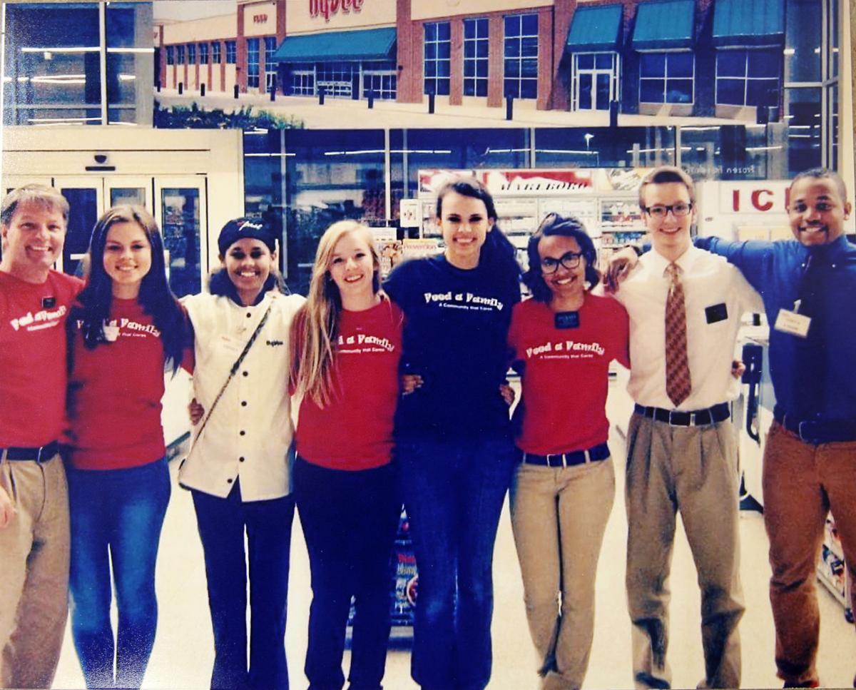 Double duty: Hy-Vee store director is father of nine