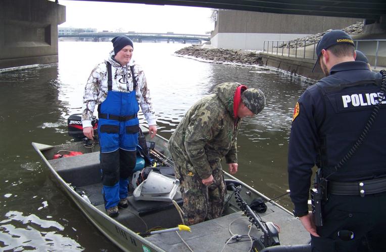 VIDEO: Fishermen rescue dog from frigid river