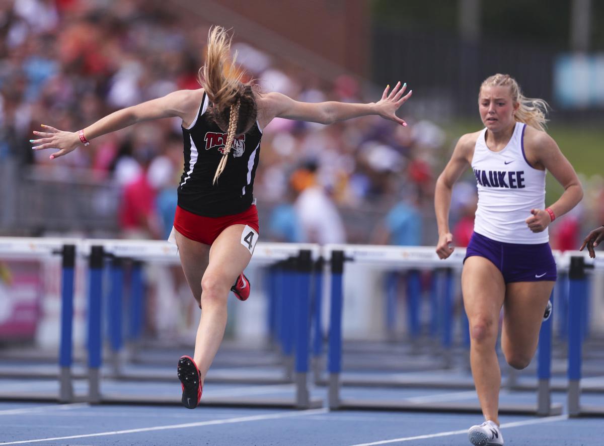 Maddy McFarland battles to second place in the 4A 100 hurdles