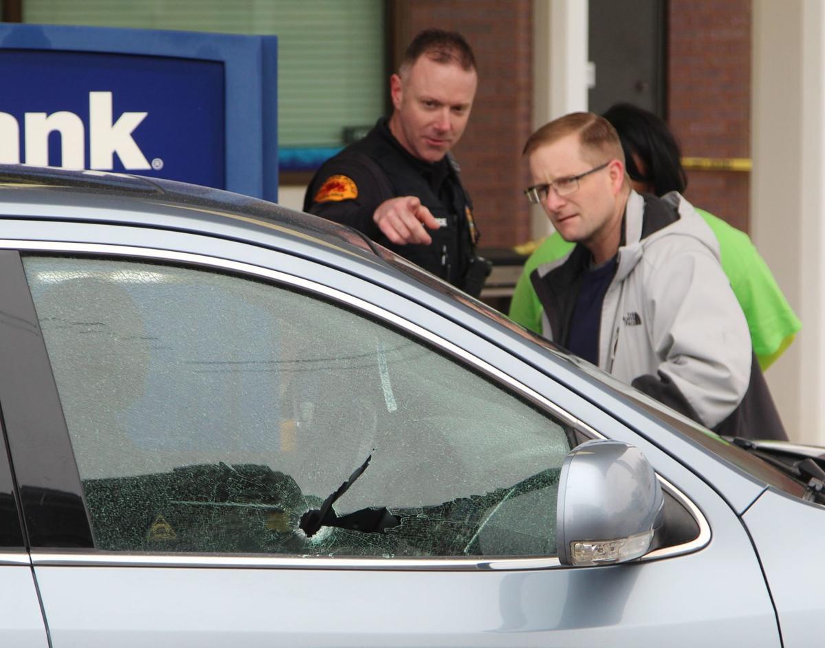 UPDATE: One detained, one dead in armored car robbery