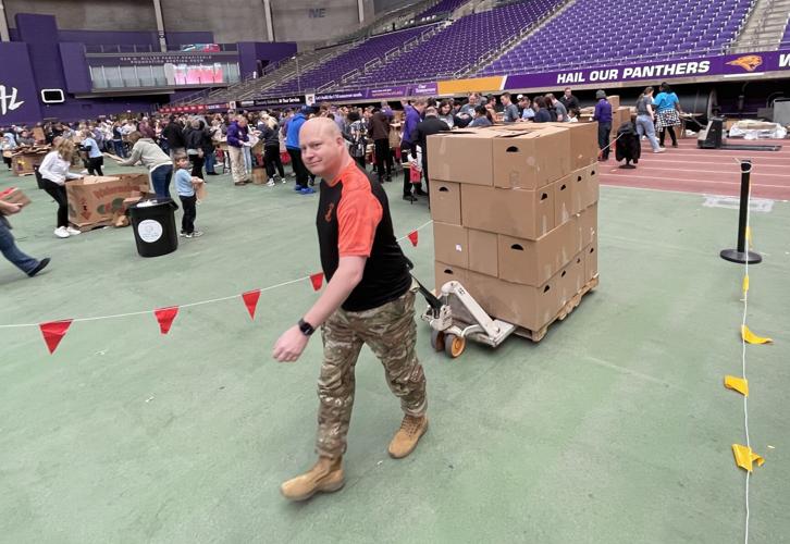Volunteers pack the UNI-Dome to combat child hunger