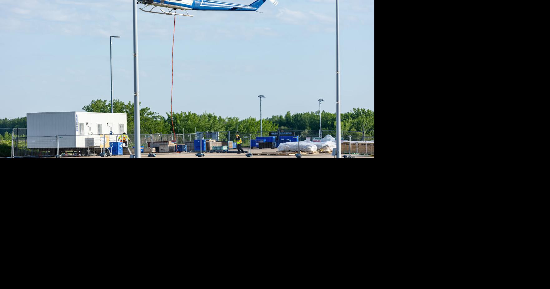 Helicopter transports materials as work begins on UNI-Dome