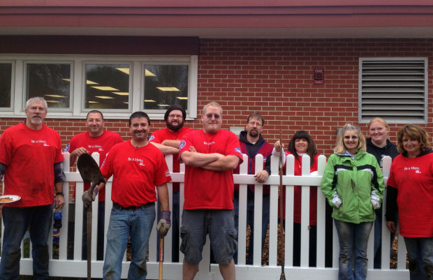 Lowe's Heroes volunteers update landscaping at Community Services Building