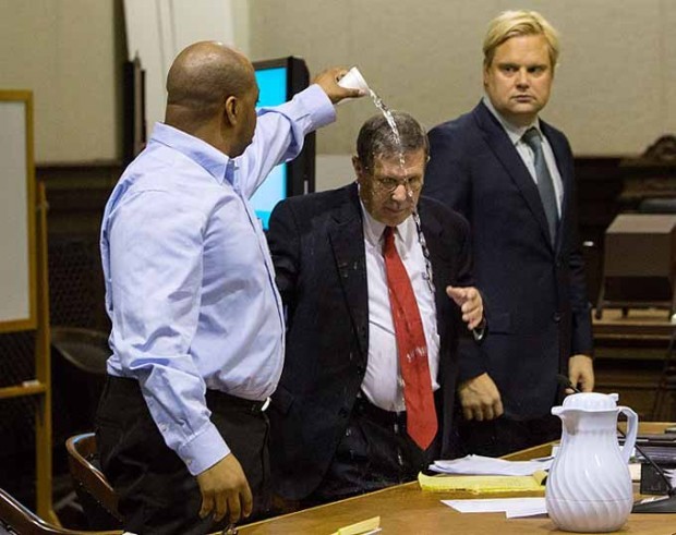 PICTURE: Defendant throws water on his attorney after closing arguments