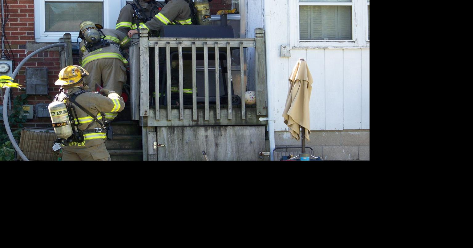 Firefighters extinguish porch fire