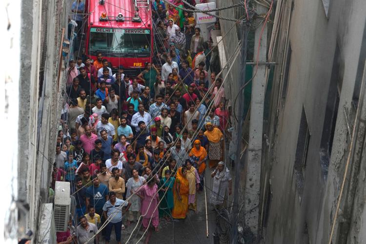 Photos show a rescue operation in a New Delhi hotel fire | News ...