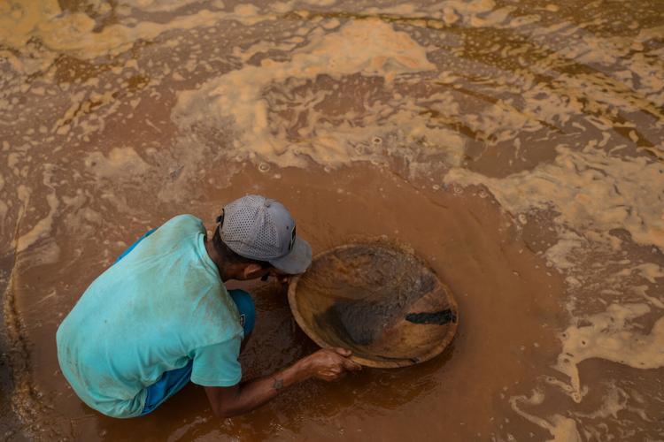 Photos show miners in El Callao, Venezuela, where gold has become an ...
