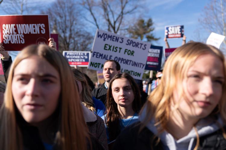Photos of demonstrators outside the Supreme Court as it considers ...