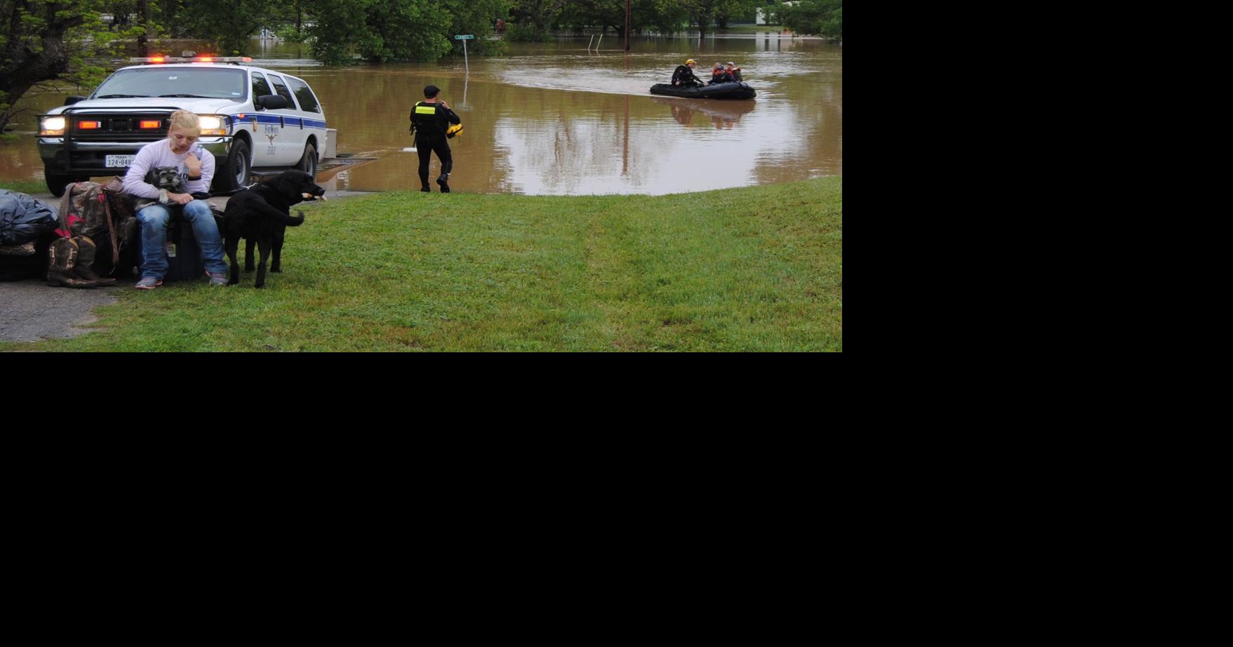 Flood waters rising as firefighters rescue stranded river residents ...