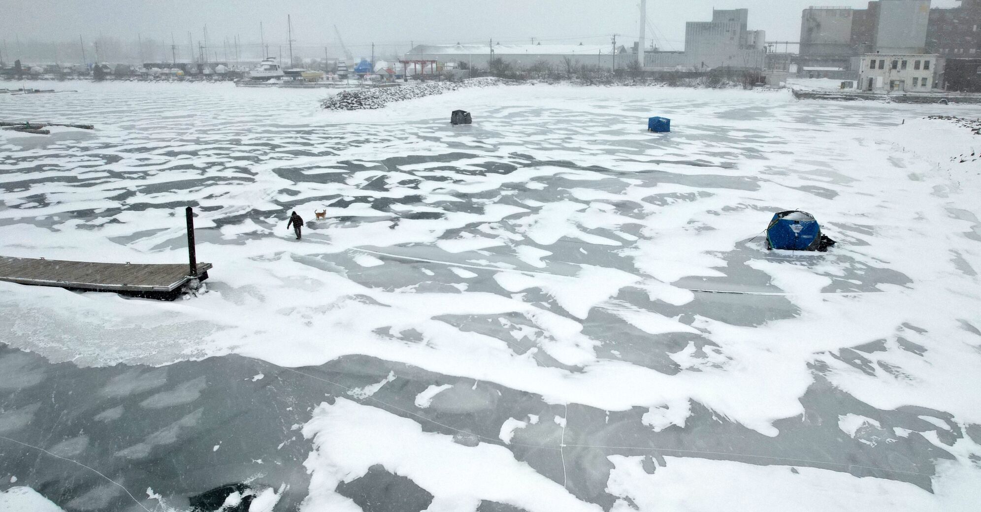 Photos: Anglers fish for ‘big one’ during Sunday snowstorm