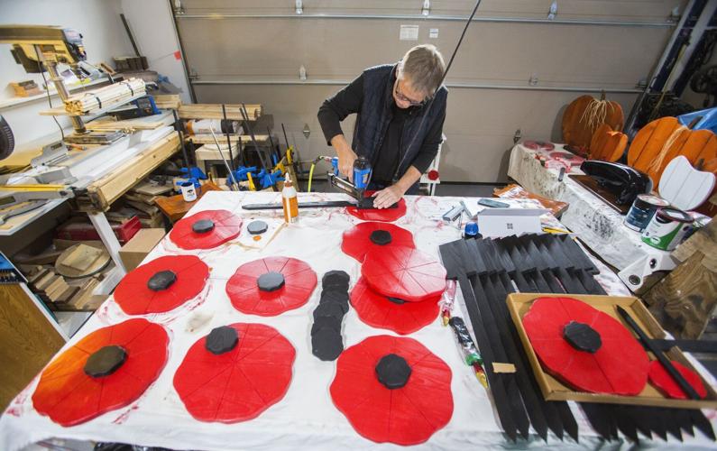 Wood craftsmen make poppies in honour of Remembrance Day