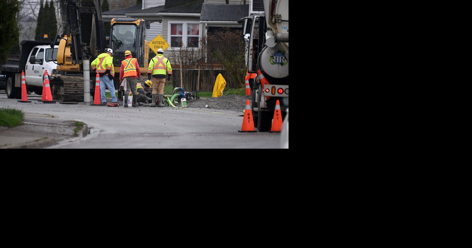 Photo: Contractors work to fix sanitary sewer backup