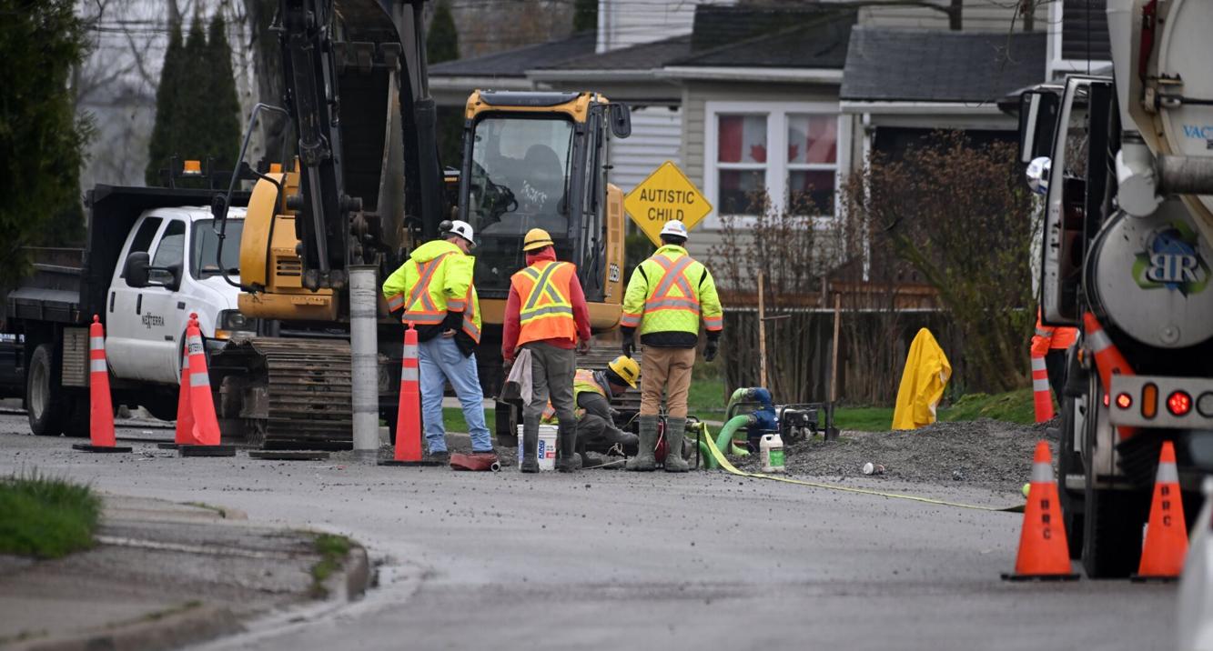 Photo: Contractors work to fix sanitary sewer backup