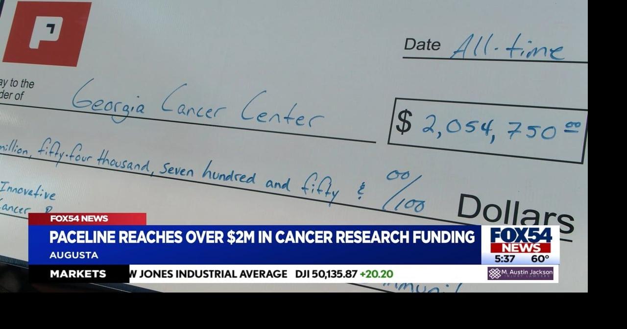 PACELINE presents a check to the Georgia Cancer Center from its 2025 ...