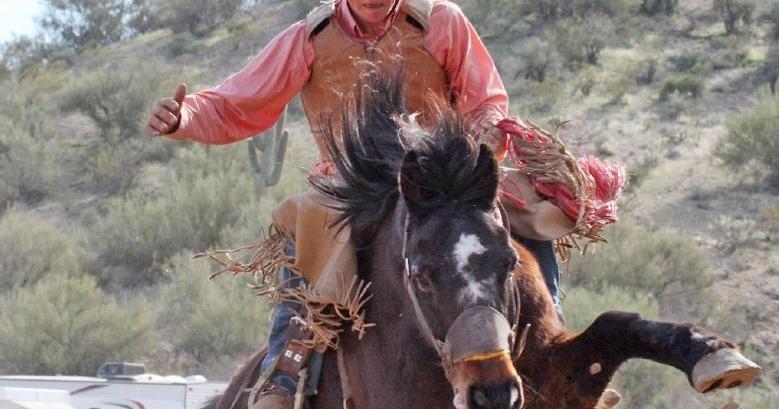 Cody Mooney makes an eight-second ride at the Gold Rush Days rodeo on ...