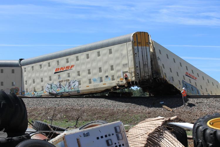 23 freight cars, dozens of new vehicles damaged in BNSF train ...