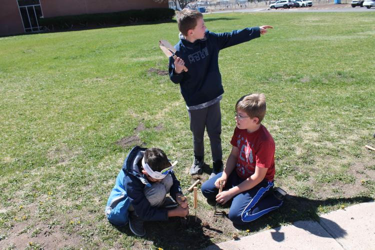 WEMS students mark Earth Day with performance, campus cleanup ...