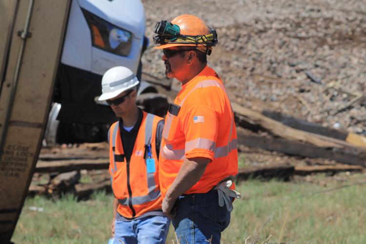 23 freight cars, dozens of new vehicles damaged in BNSF train ...