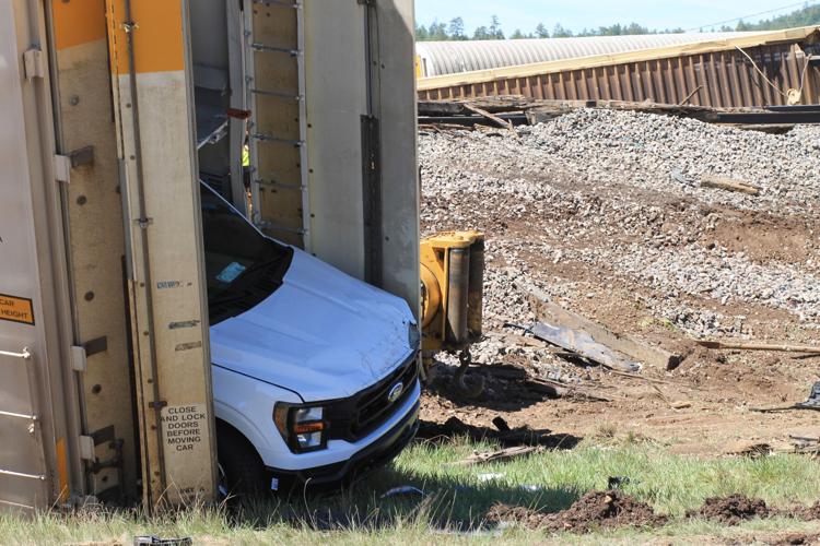 23 freight cars, dozens of new vehicles damaged in BNSF train ...