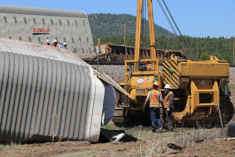 23 freight cars, dozens of new vehicles damaged in BNSF train ...