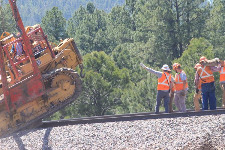 23 freight cars, dozens of new vehicles damaged in BNSF train ...
