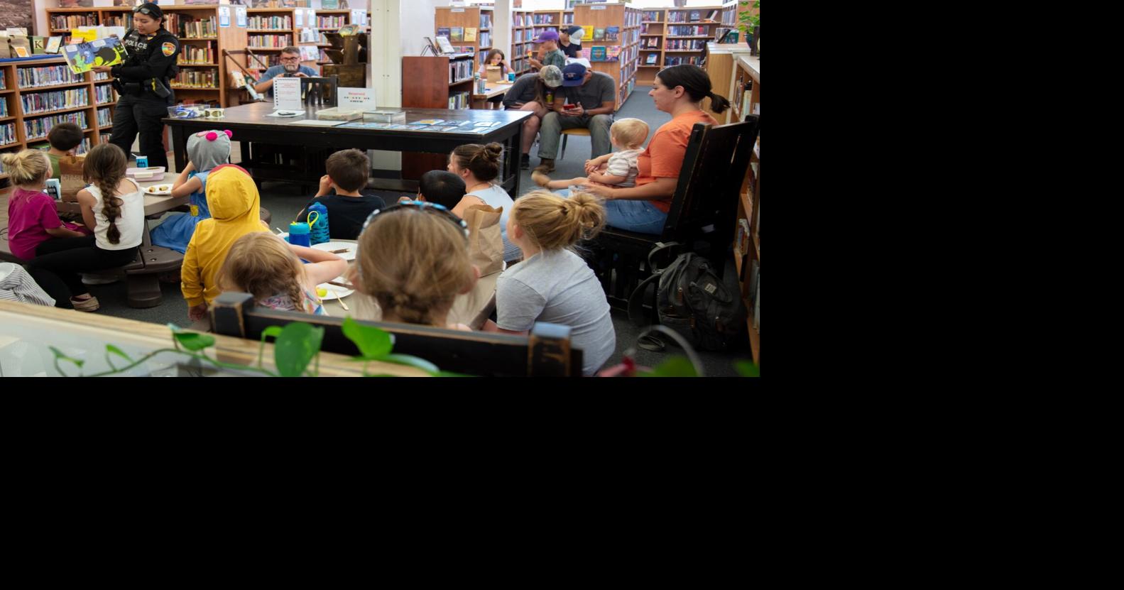 Officer Dash, Chief Pearson read to kids at library Story Time ...