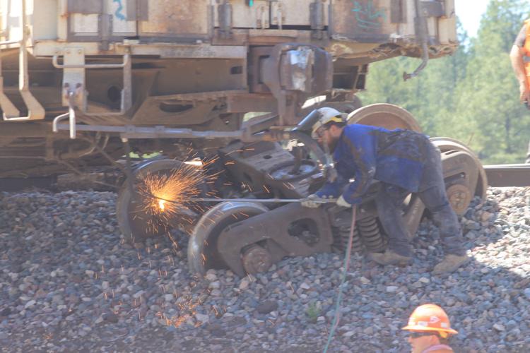 23 freight cars, dozens of new vehicles damaged in BNSF train ...