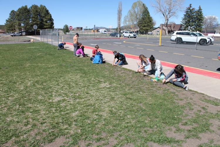 WEMS students mark Earth Day with performance, campus cleanup ...