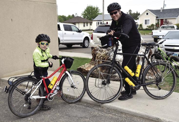 Father and son visit Williston during trek across United States ...