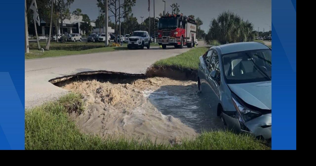 Water washes away road after a car crashes into fire hydrant in Lee ...