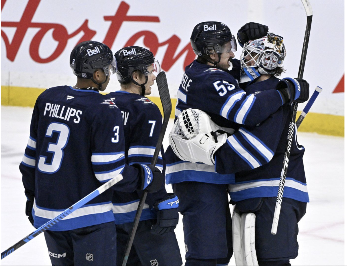 Jets goalie Eric Comrie shines in victory over Blues | Sports ...