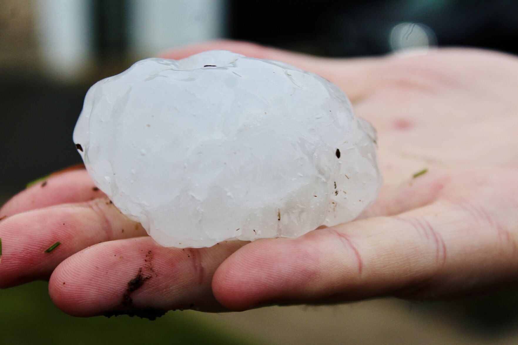 IN PHOTOS: Large hail knocks out windows, damages vehicles in Eau Claire