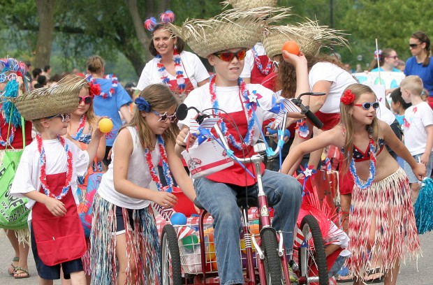 Kids love a parade: Butterflies, candy and a crowd-pleasing cow