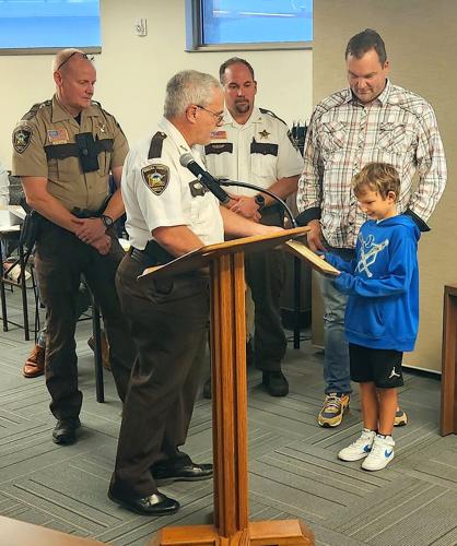 Boy, 7, awarded for rescuing father after UTV accident outside Winona