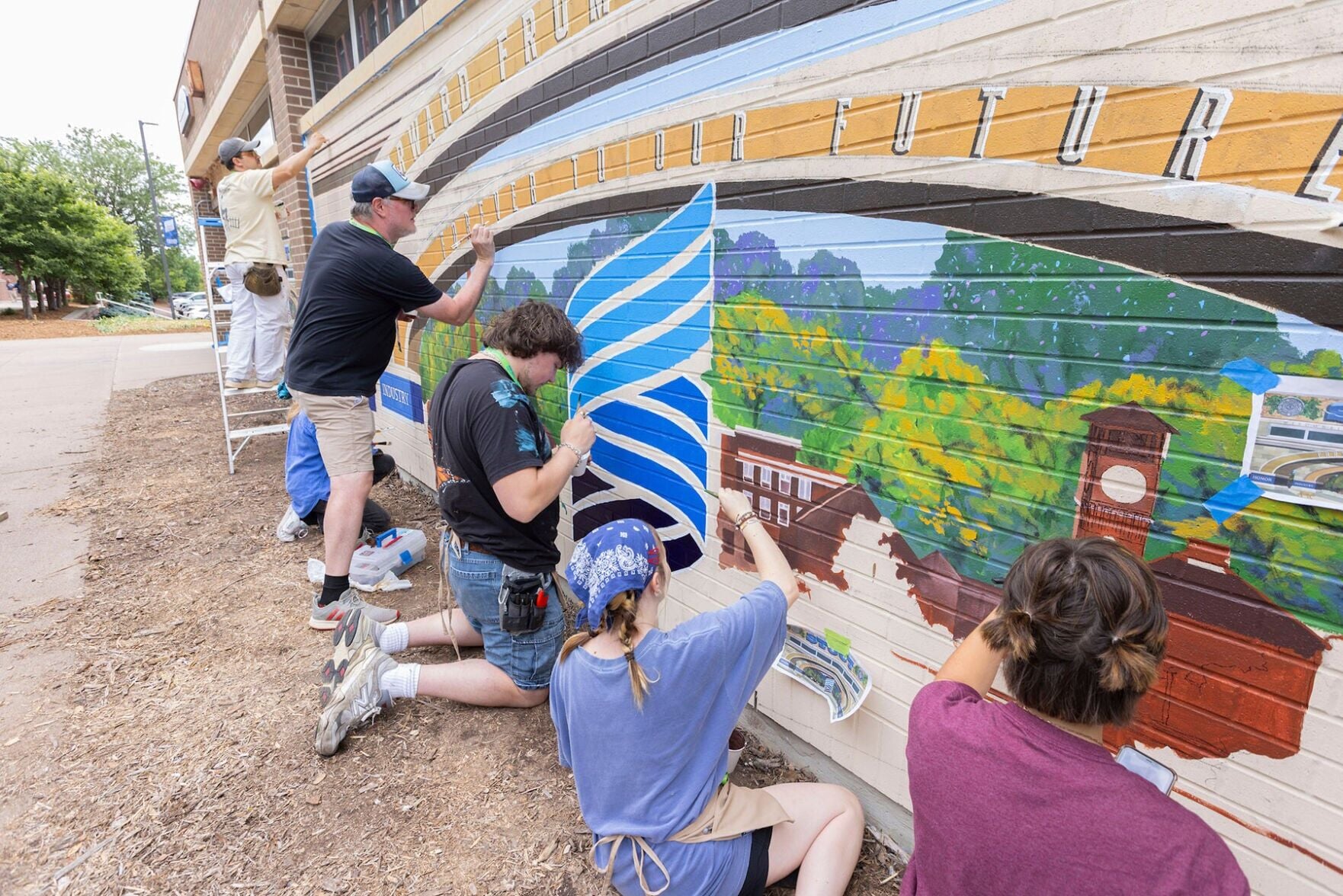 Students, staff help turn community into a canvas at mural event