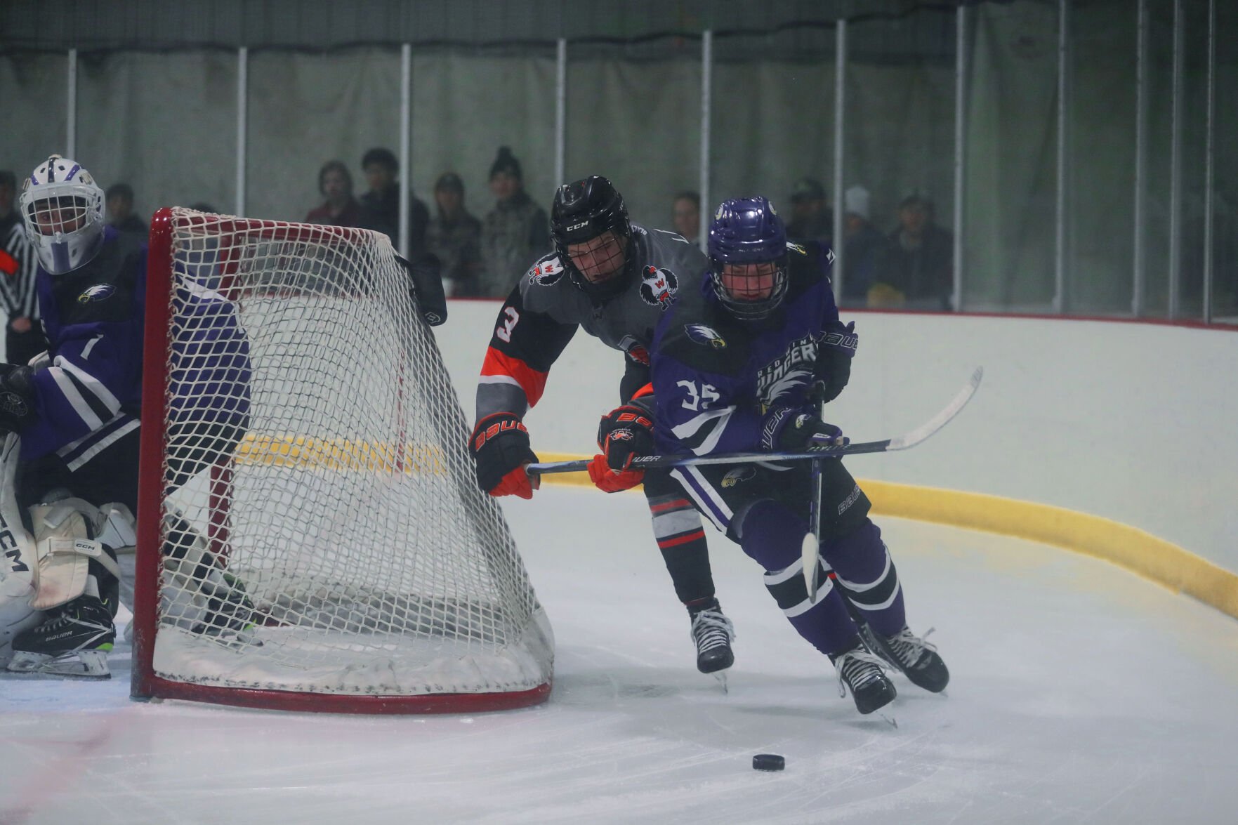 Photos: Winona boys hockey keeps the 'Barge Rope' in blowout over Red Wing