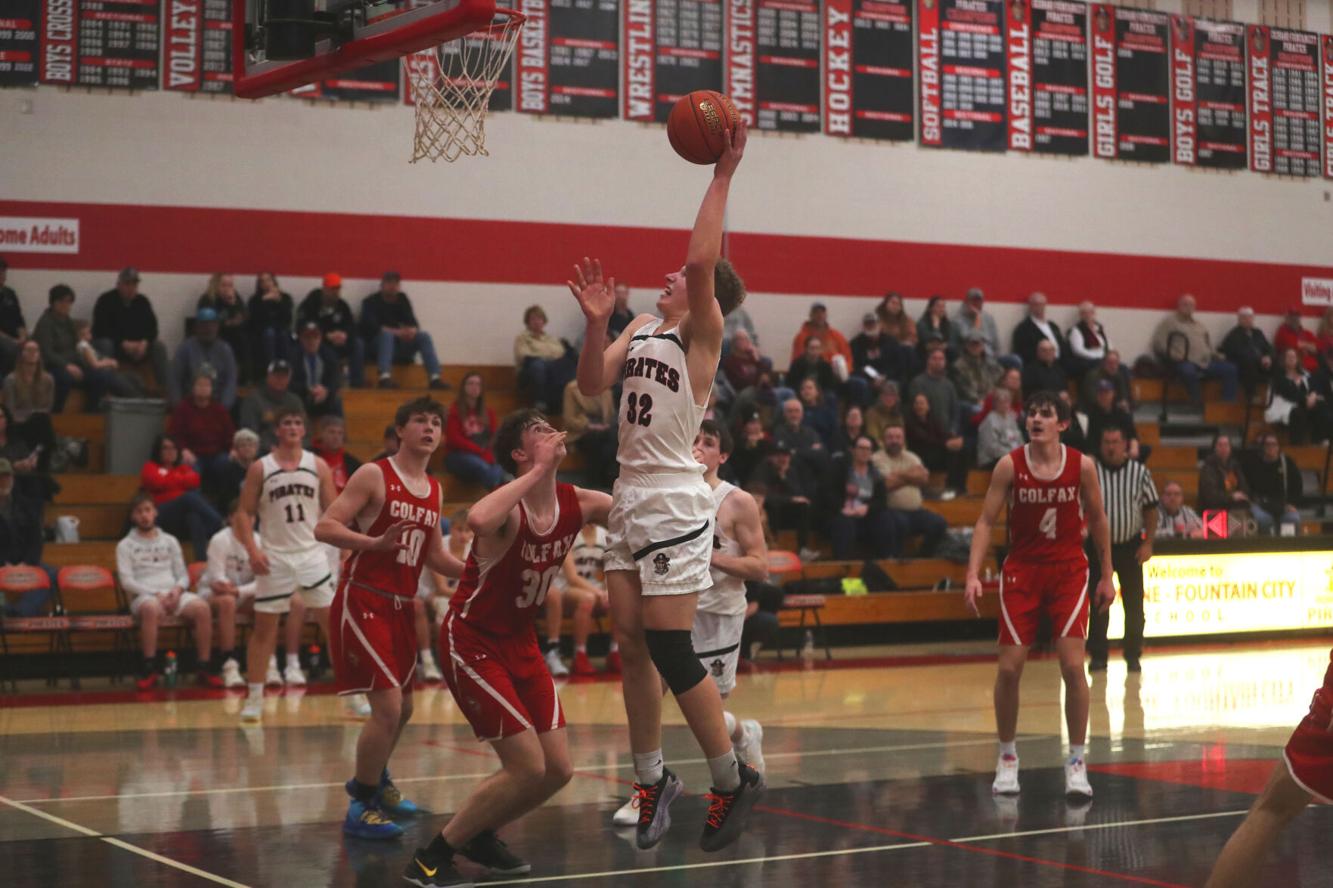 Photos: Cochrane-Fountain City boys basketball topples Colfax