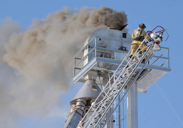 Grain elevator blaze tests fire department's reach