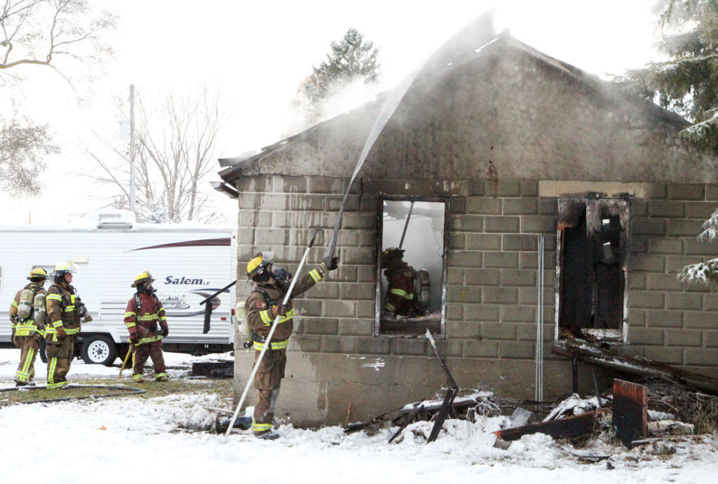 Neighbor spots garage fire; no one hurt