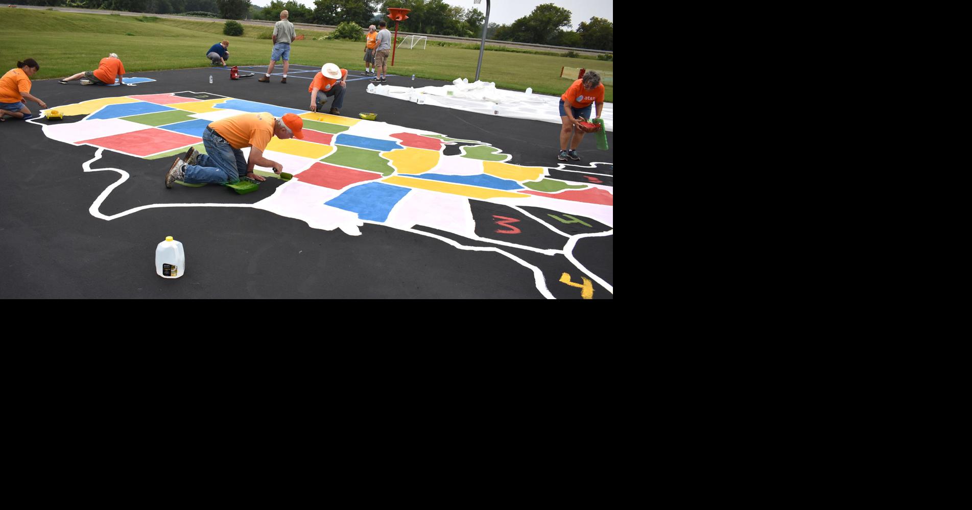 Volunteers map out Rio playground attraction