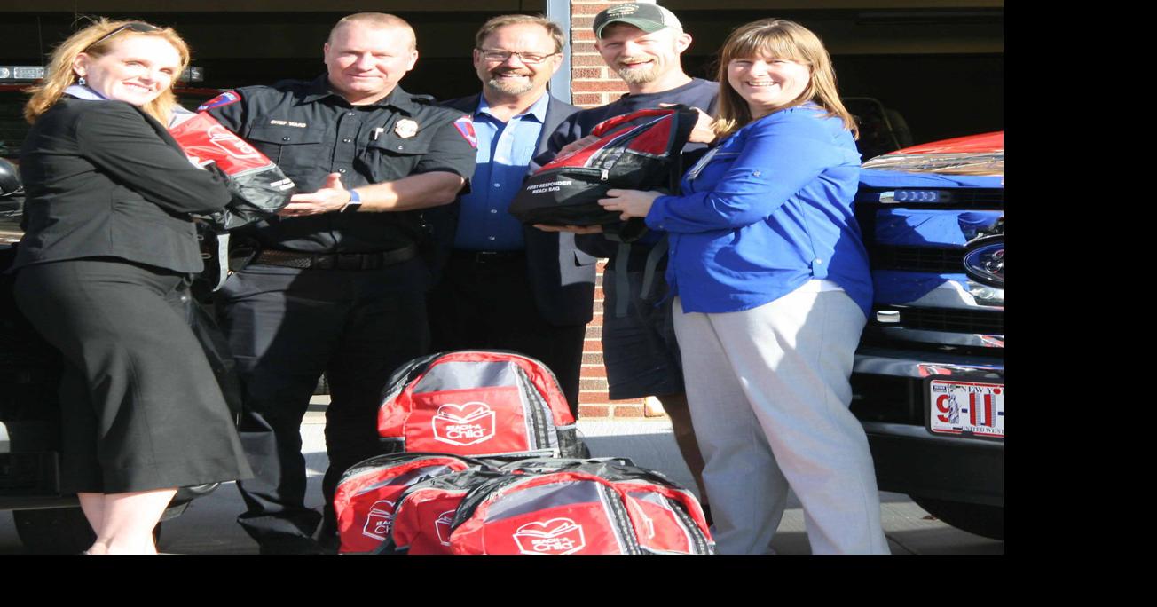 Dells fire, police departments receive help to 'REACH-A-Child'