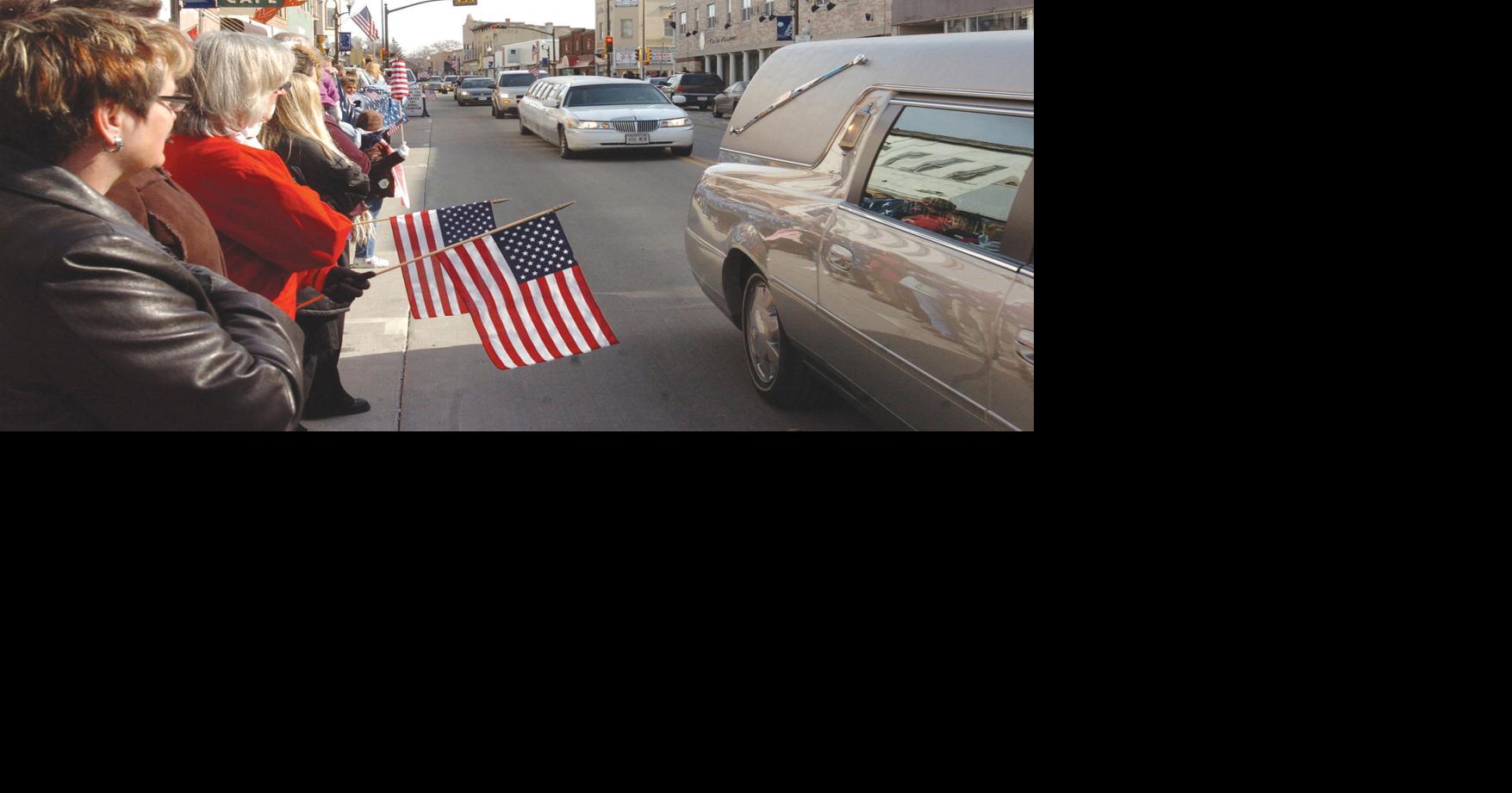 Residents line downtown streets for ‘sad parade’